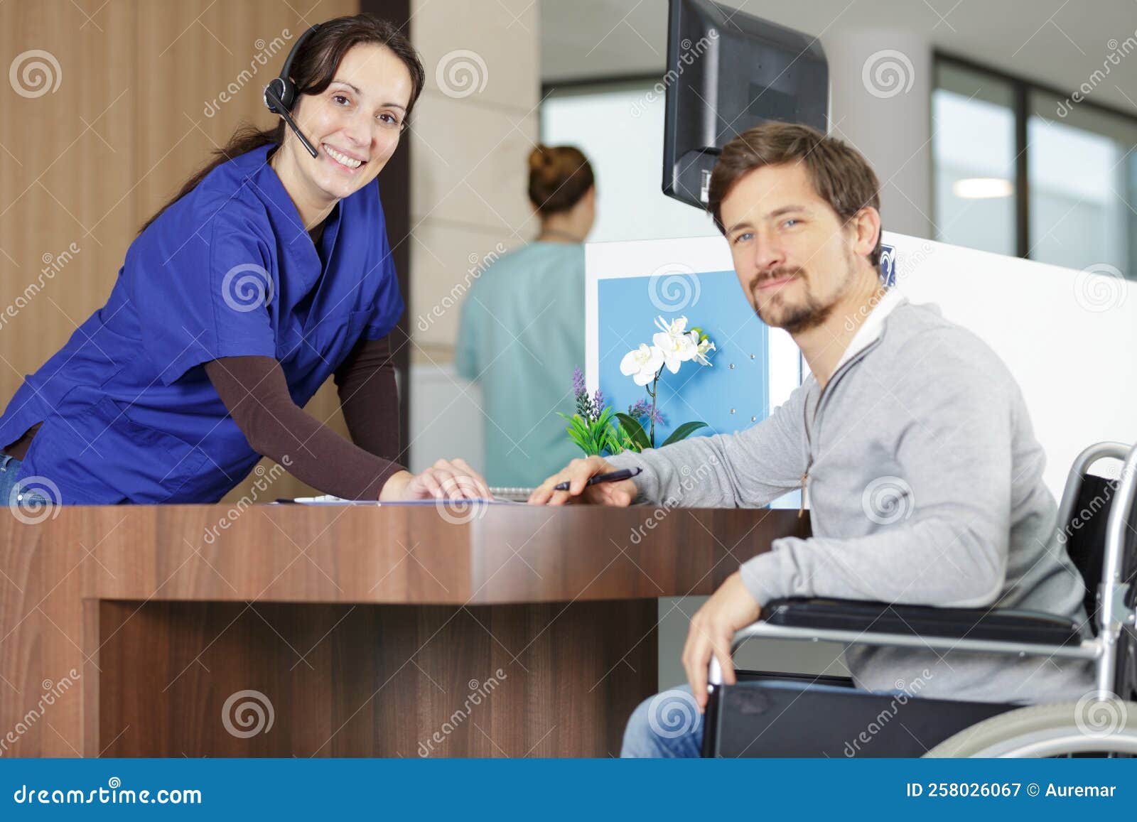 Disabled Man at Reception Desk in Hospital Stock Image - Image of ...