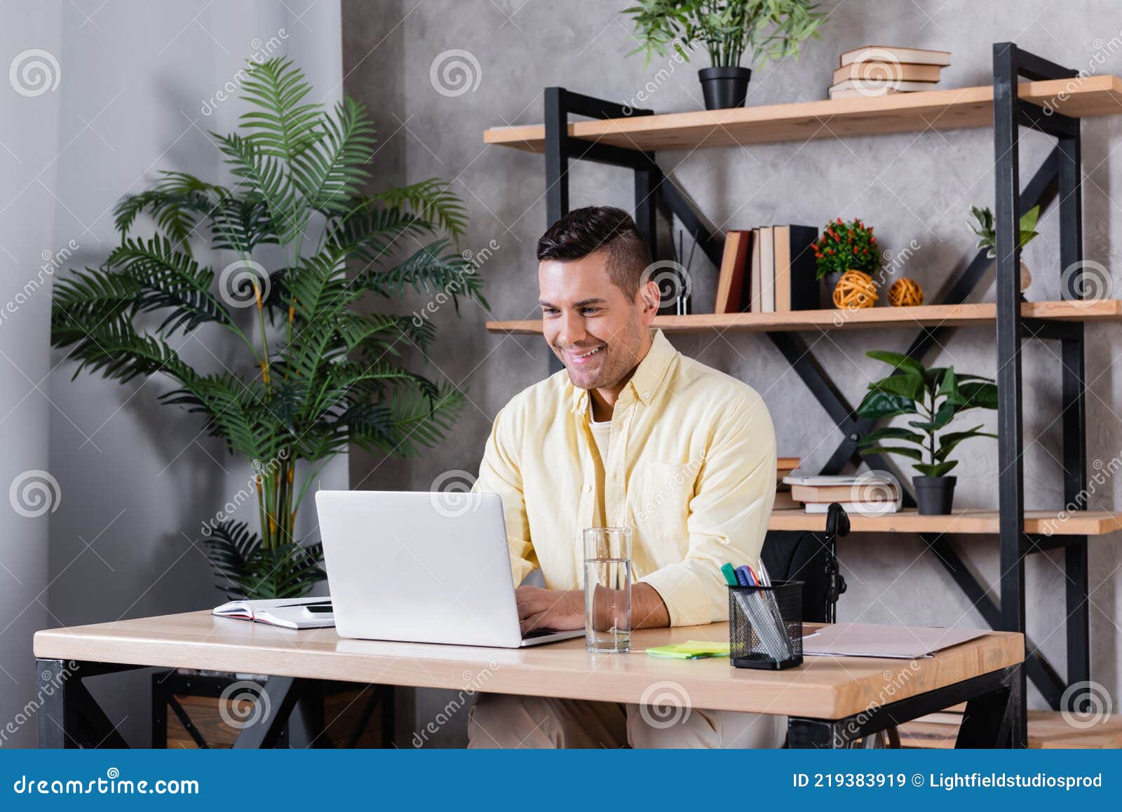 Disabled Man Smiling while Typing on Stock Image - Image of books ... Disabled Man Smiling while Typing on Stock Image - Image of books ...