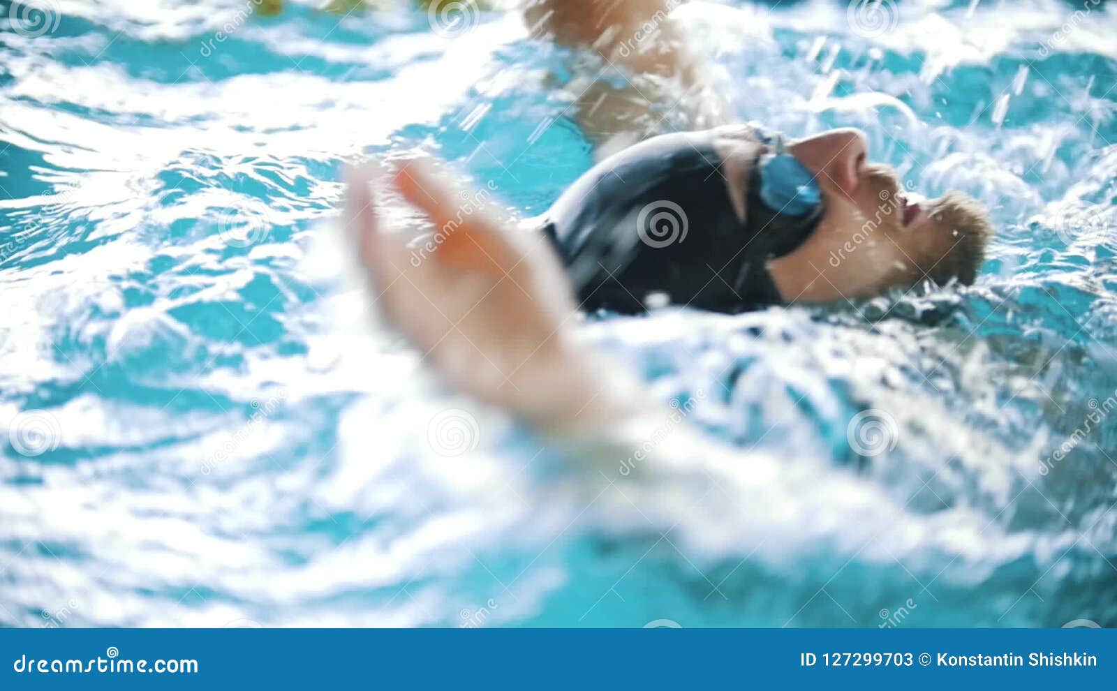 Disabled Man Swims on the Back in a Swimming Pool. Slow Motion. Side ...