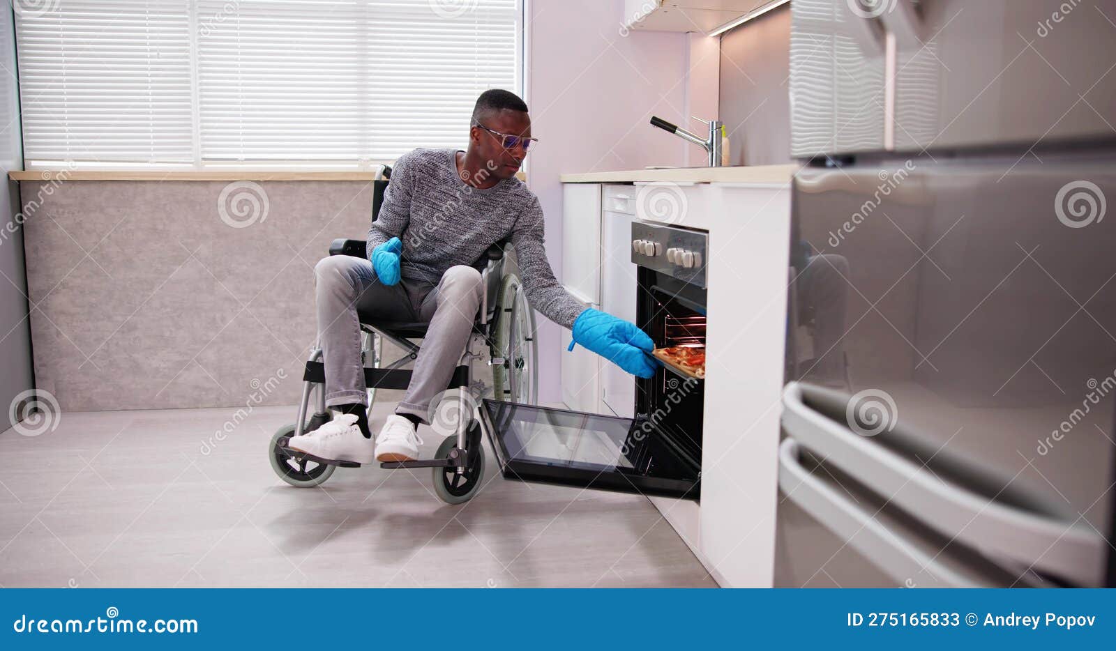 Disabled Man Using Microwave Oven for Baking Stock Image - Image of ...