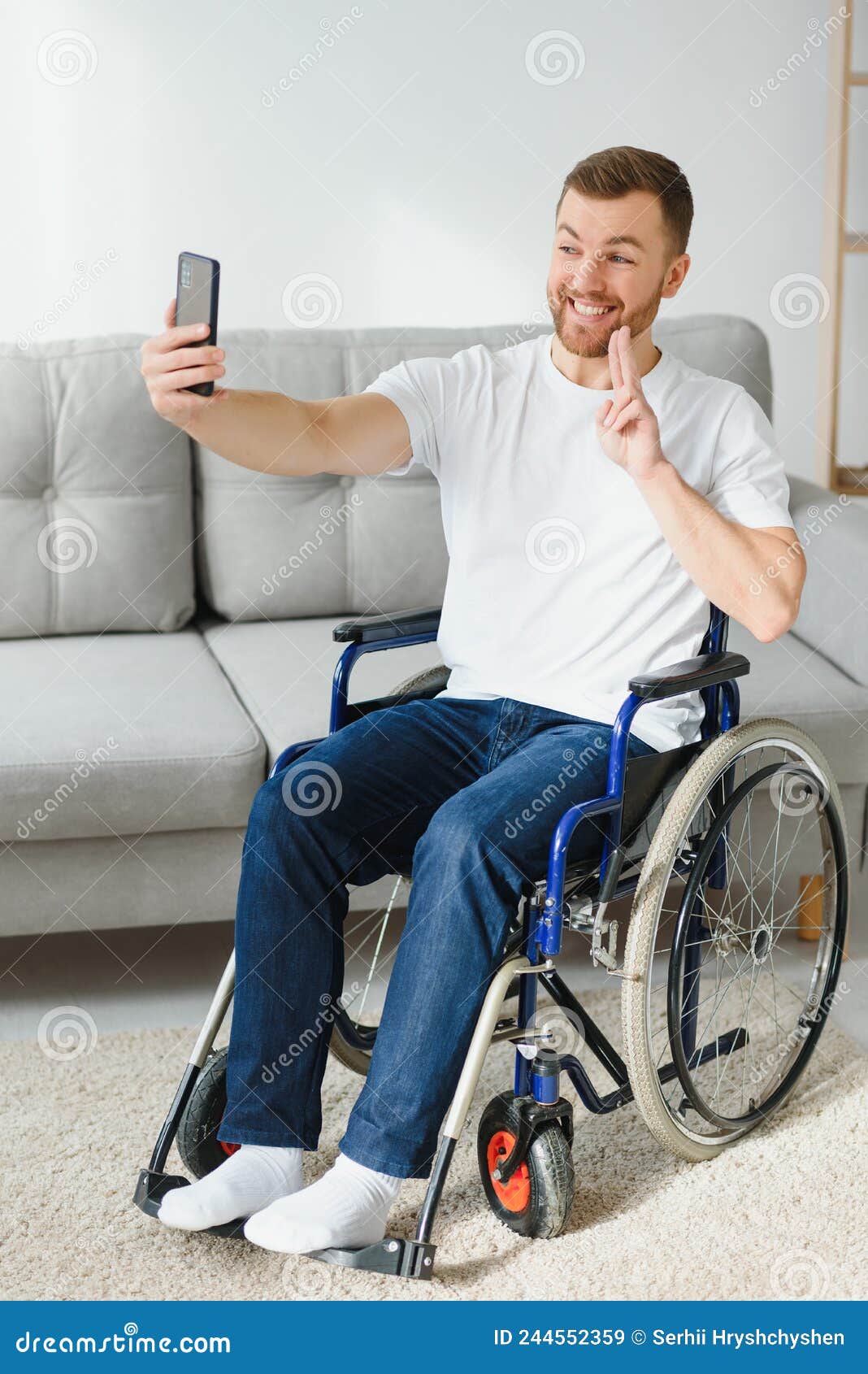 Disabled Man Using Modern Smartphone for Video Conversation while ...