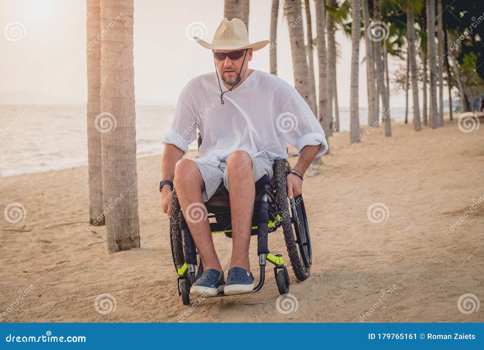 Disabled Man in a Wheelchair on the Beach. Stock Image - Image of ...