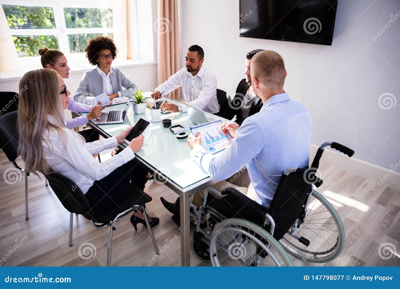 Disabled Manager Sitting with His Colleagues Stock Image - Image of ...
