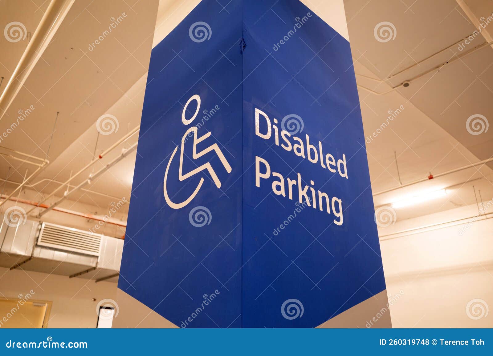 A Disabled Parking Sign Painted on a Building Column Stock Photo ...