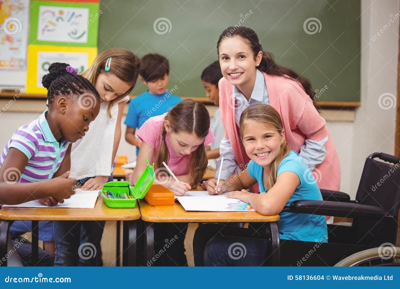 Disabled Pupil Smiling at Camera in Classroom Stock Photo - Image of ...