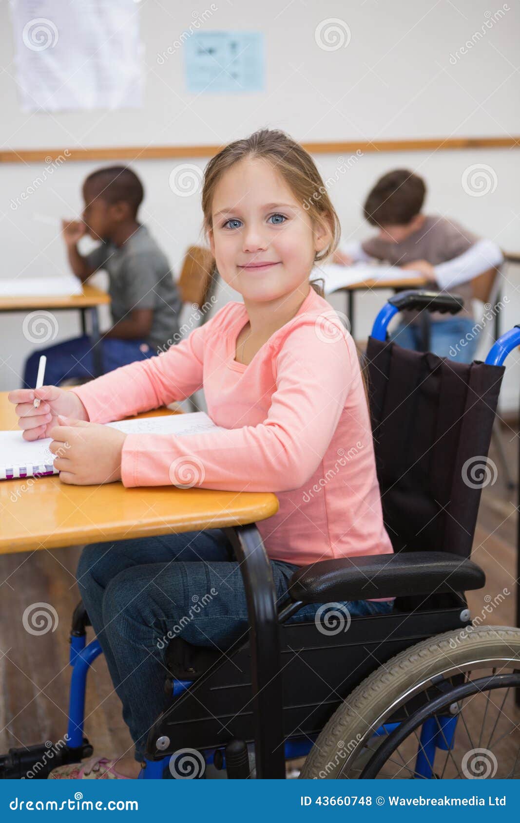 Disabled Pupil Smiling at Camera in Classroom Stock Photo - Image of ...