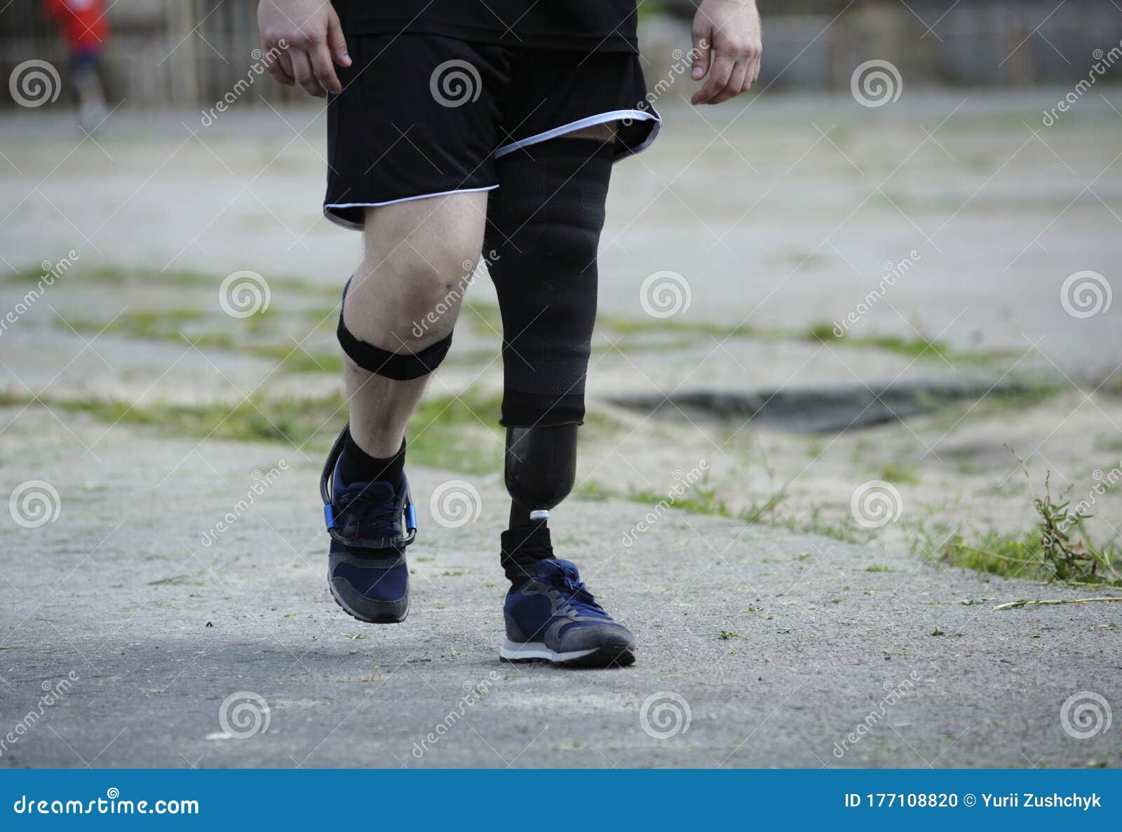 Disabled Runner with an Artificial Leg Walking on Stadium Stock Photo ...