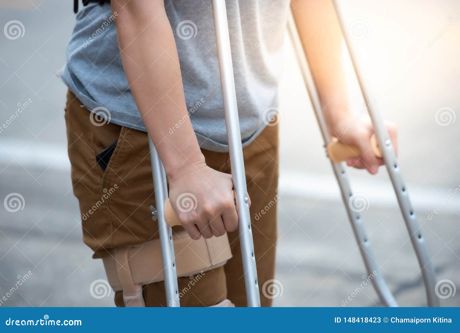 Disabled Woman with Crutches or Walking Stick or Knee Support Standing ...