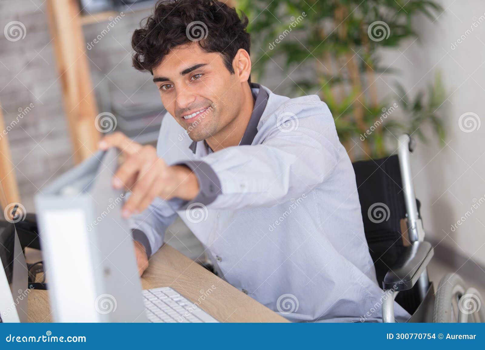 Disabled Worker at Office Reaching Folder Stock Photo - Image of ...