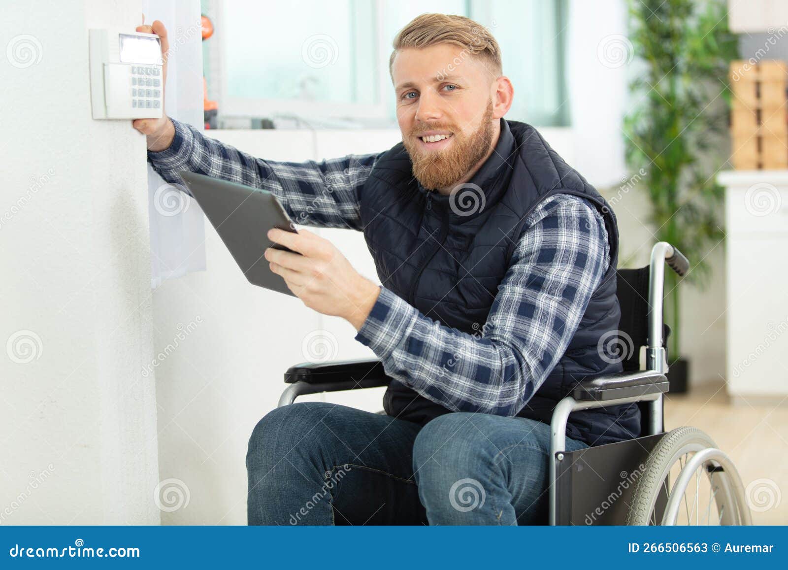 Disabled Worker in Wheelchair Installing Alarm Stock Image - Image of ...