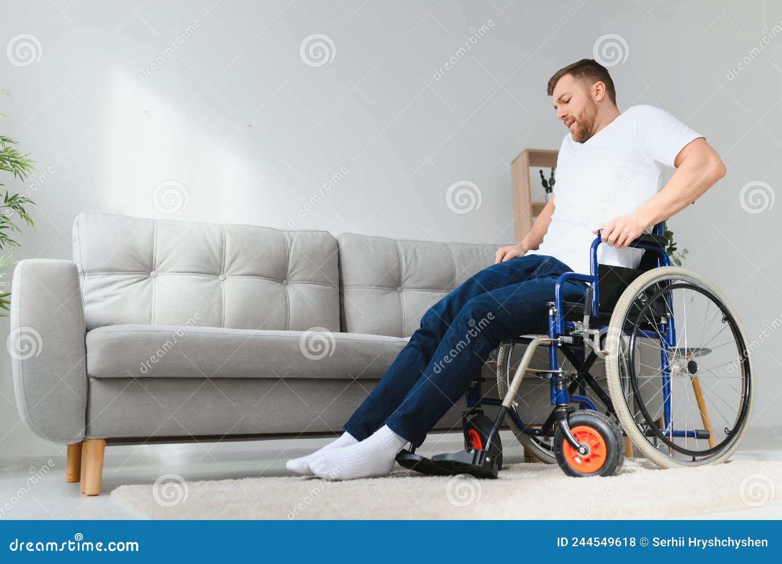 Disabled Young Black Guy Trying Sit Down. Stock Photo - Image of home ...
