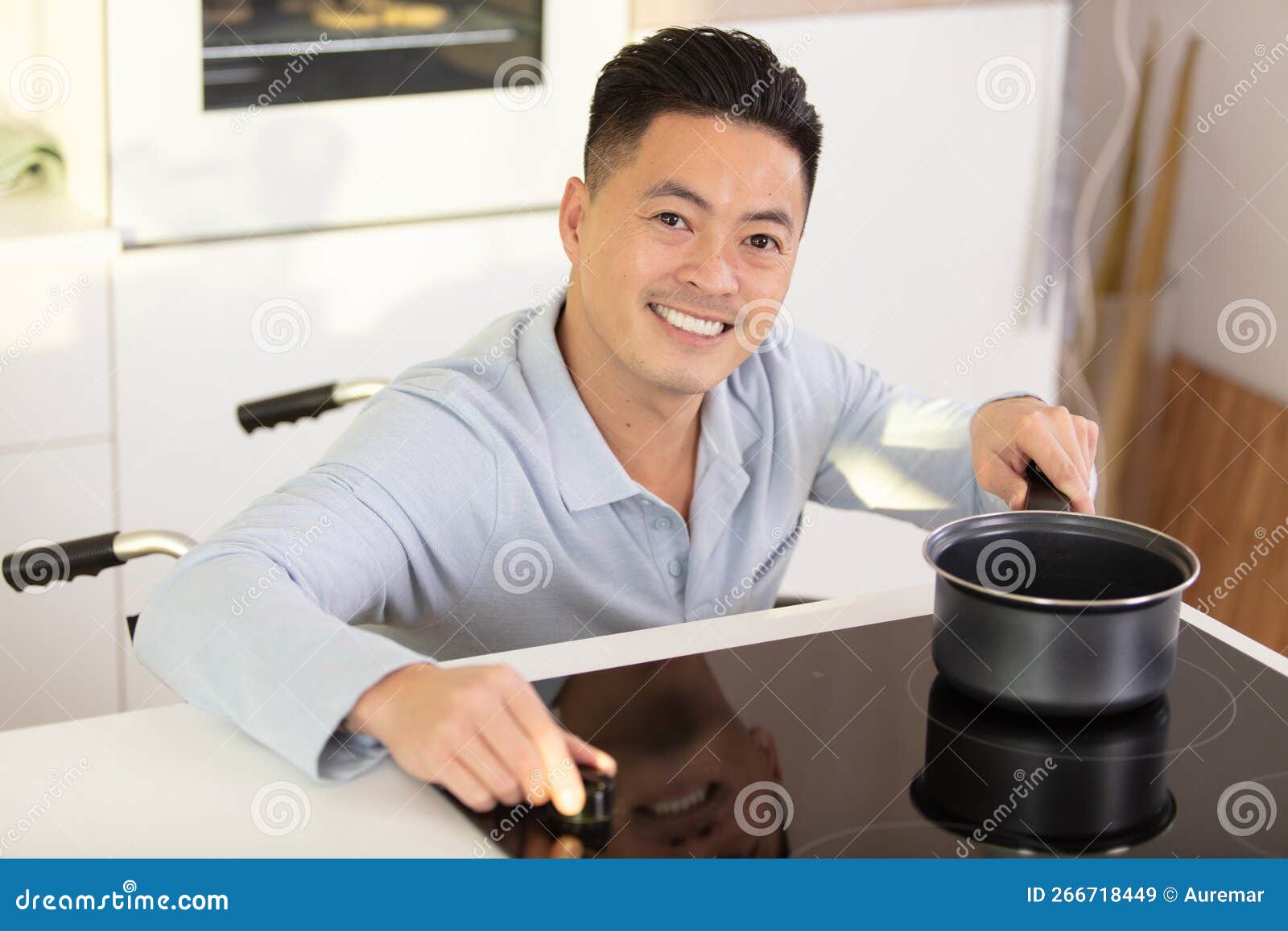 Disabled Young Man in Wheelchair Cooking in Kitchen Stock Image - Image ...