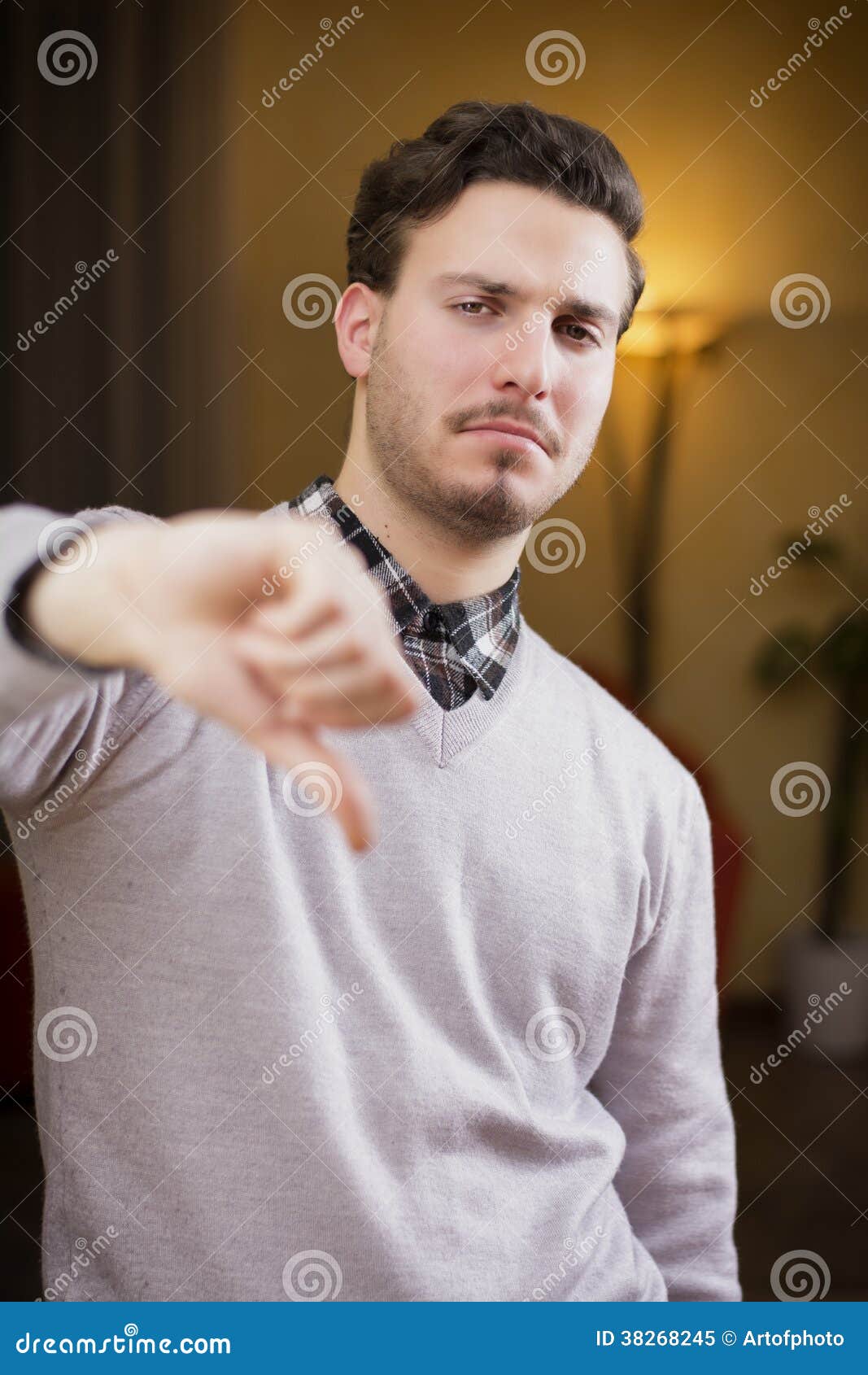 Disappointed or Displeased Young Man Doing Thumb Down Sign Stock Image ...