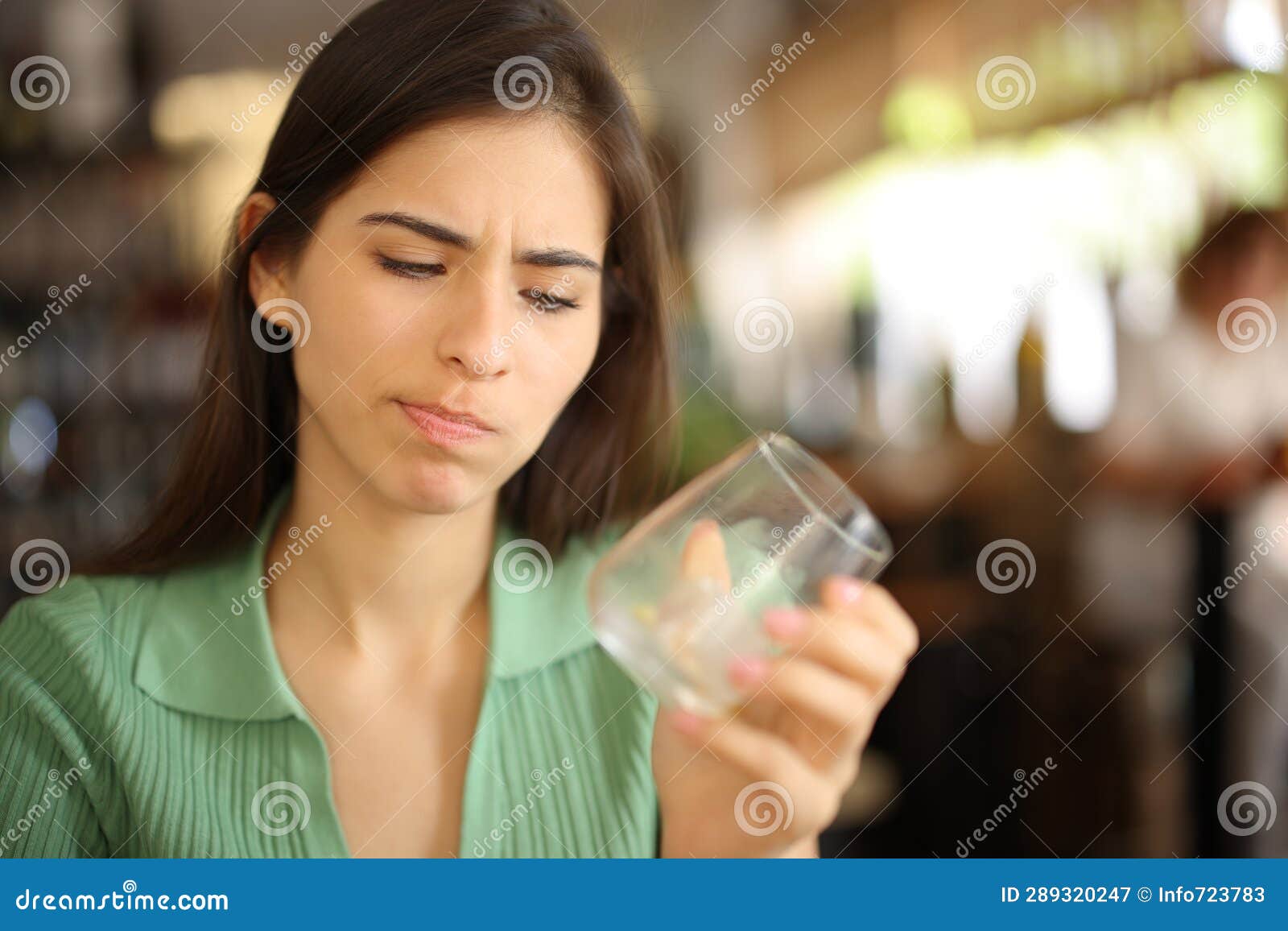 Disappointed Woman Looking at Empty Glass in a Bar Stock Image - Image ...
