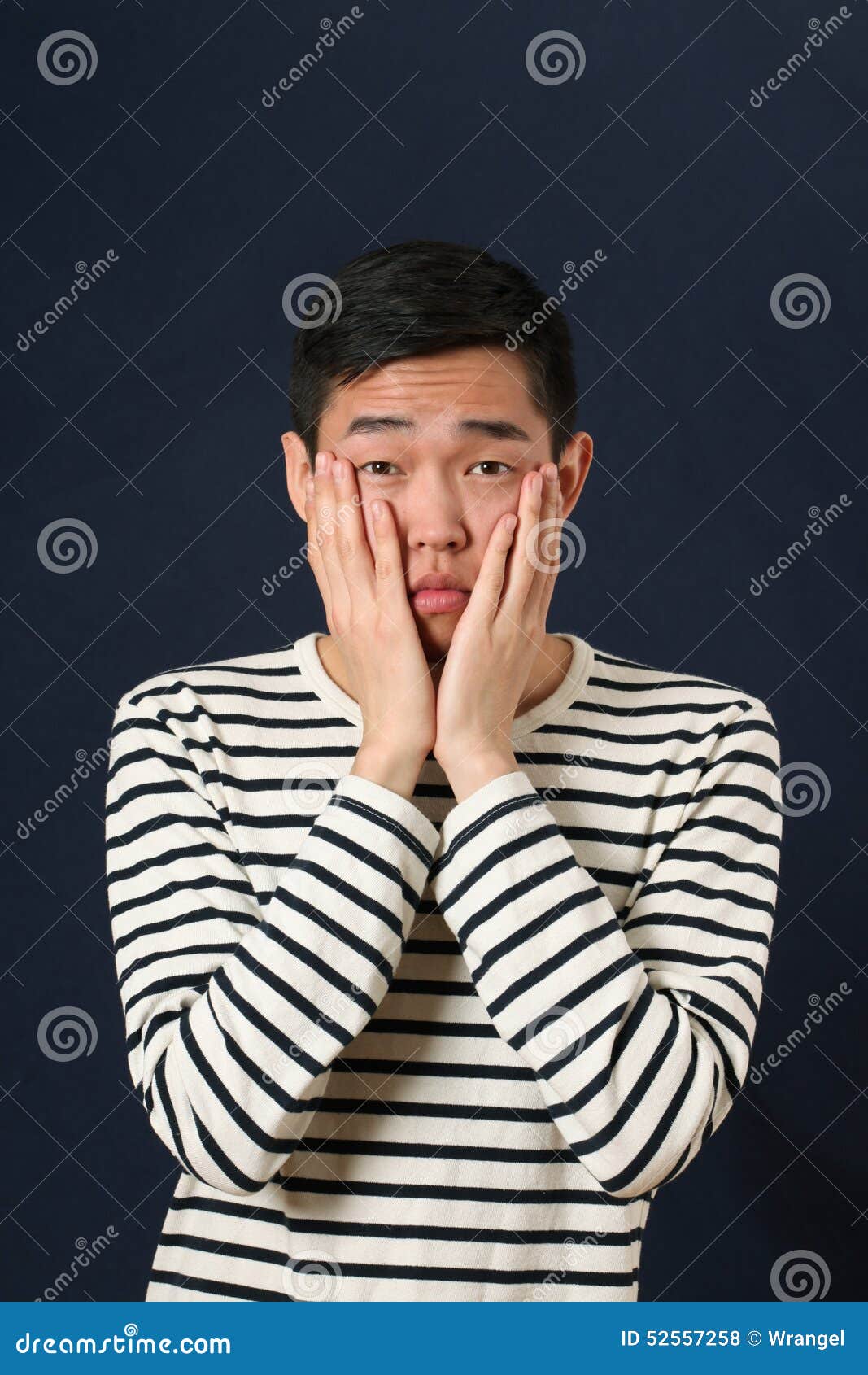 Disappointed Young Asian Man Covering His Face by Palms Stock Photo ...