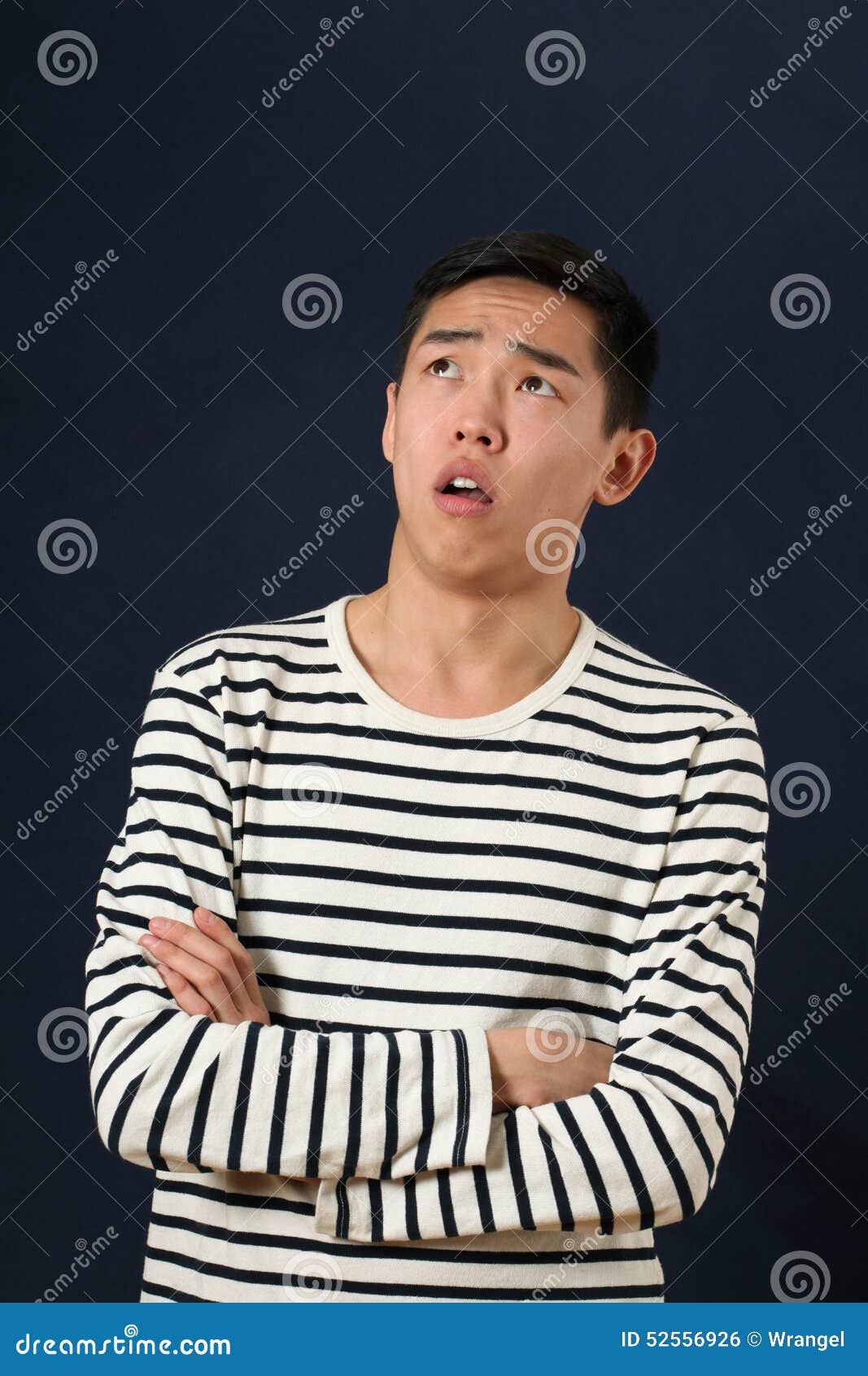 Disappointed Young Asian Man with Crossed Hands Looking Up Stock Photo ...