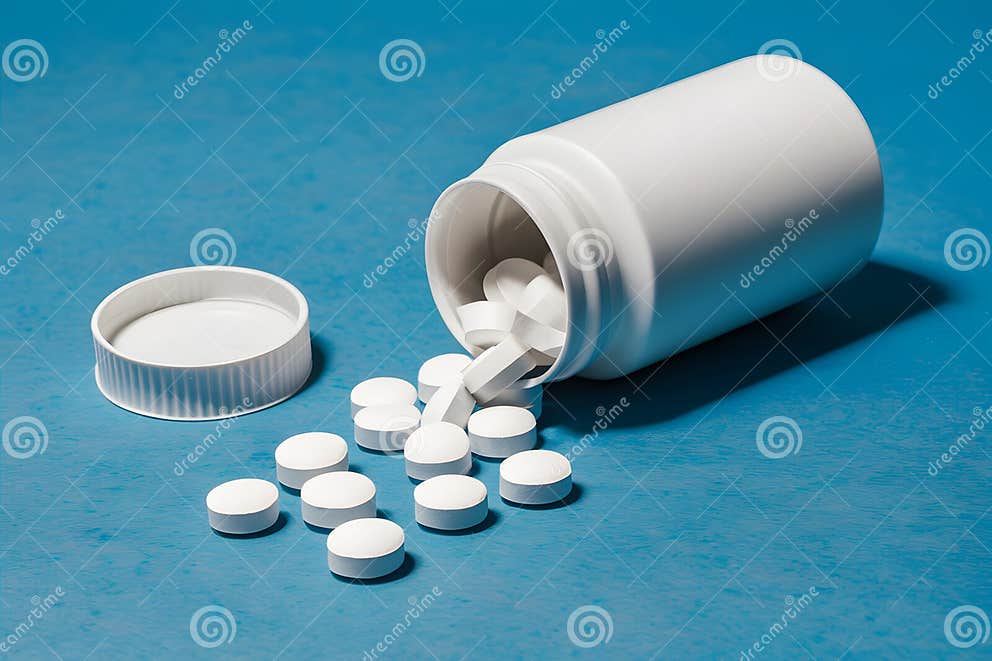 Disarrayed White Tablets Spilled from Cylindrical Container on Vibrant ...