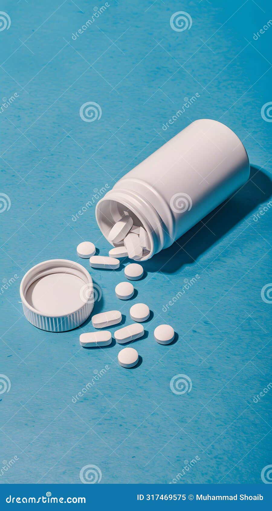 Disarrayed White Tablets Spilled from Cylindrical Container on Vibrant ...