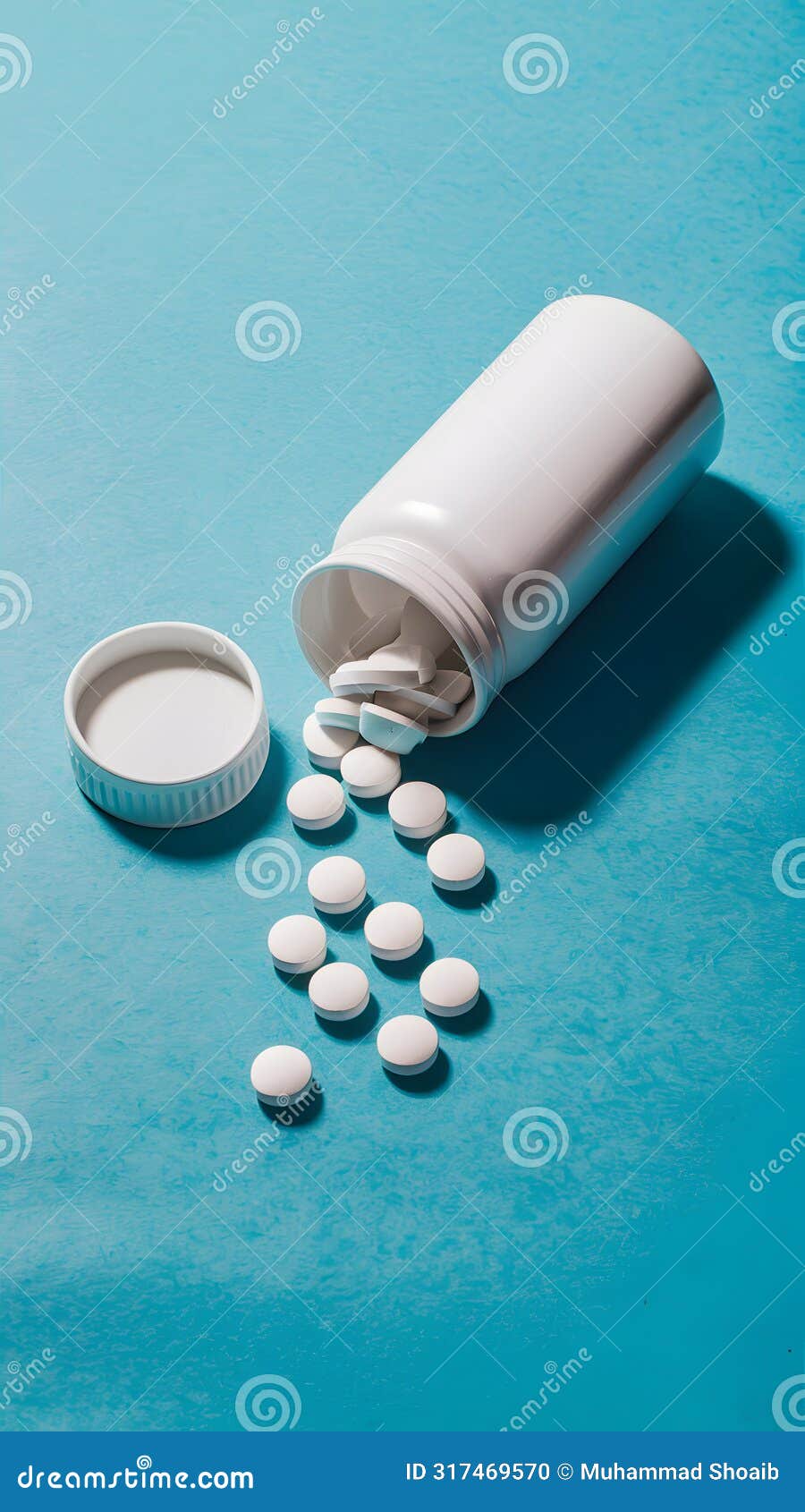 Disarrayed White Tablets Spilled from Cylindrical Container on Vibrant ...