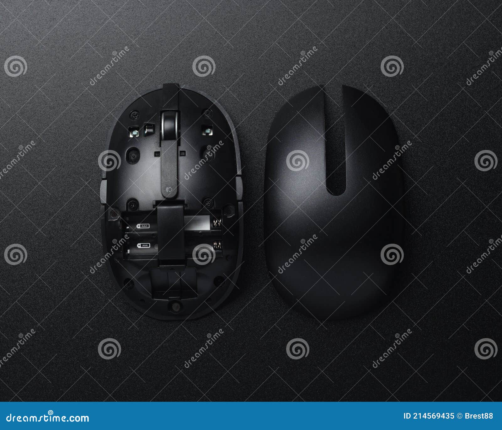 Disassembled Black Computer Mouse on a Black Plastic Background. Repair ...