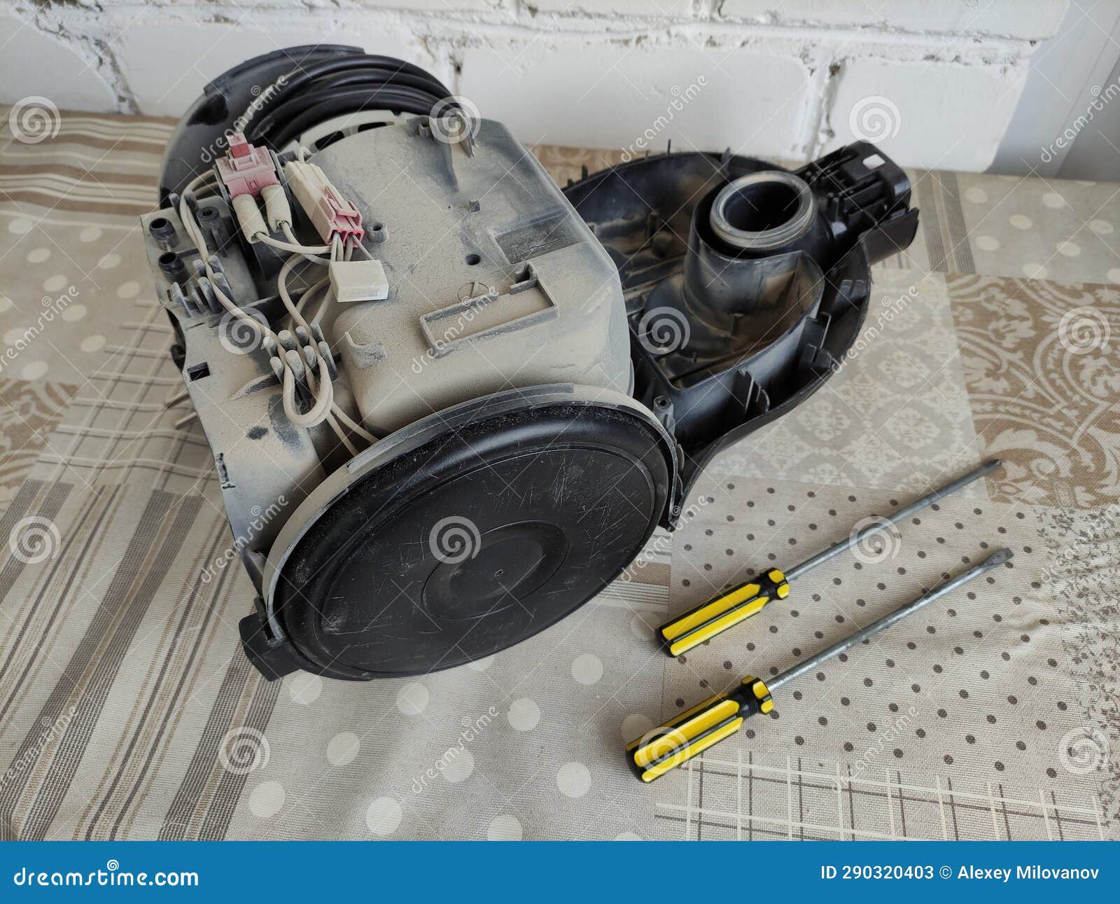 Disassembled Broken Vacuum Cleaner and Screwdrivers on the Table Stock ...
