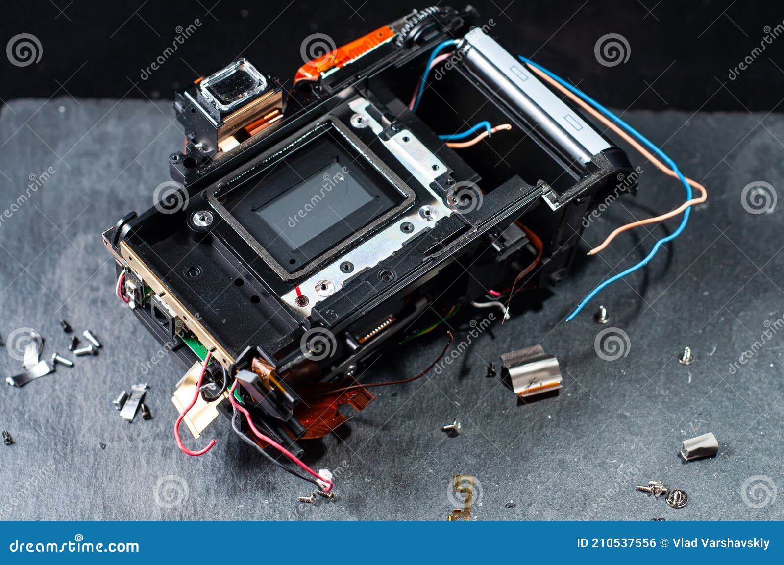 The Disassembled Camera Lies on the Subject Table in the Repair Service ...