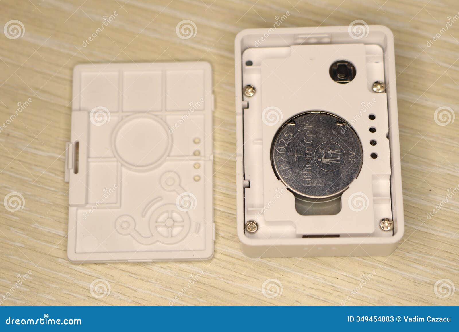 Disassembled Electronic Device Featuring a Battery Compartment for ...