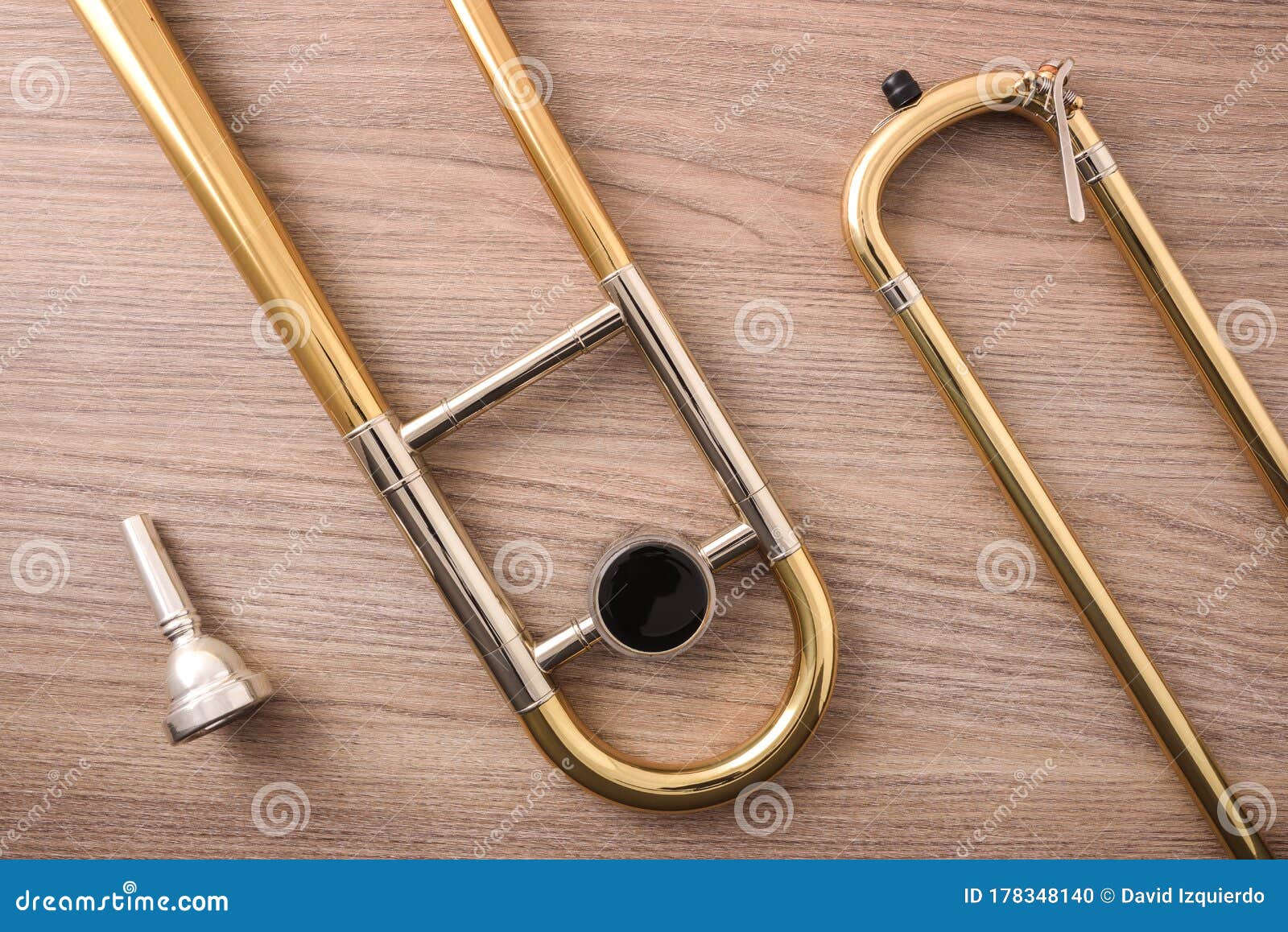 Disassembled Golden Trombone on Wooden Table Top View Stock Photo ...