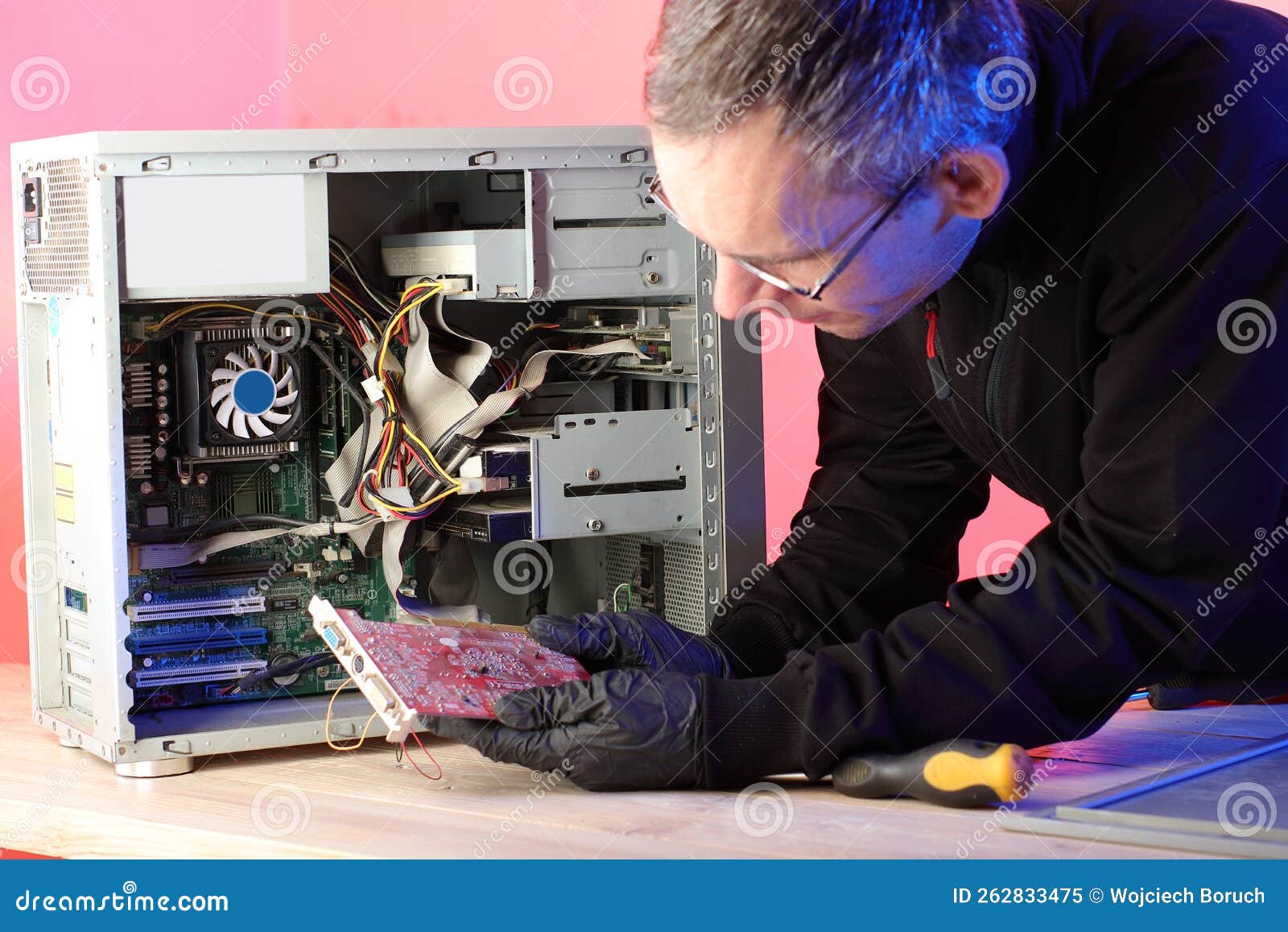 Disassembly of a Graphics Card from an Old Computer by a Person Stock ...