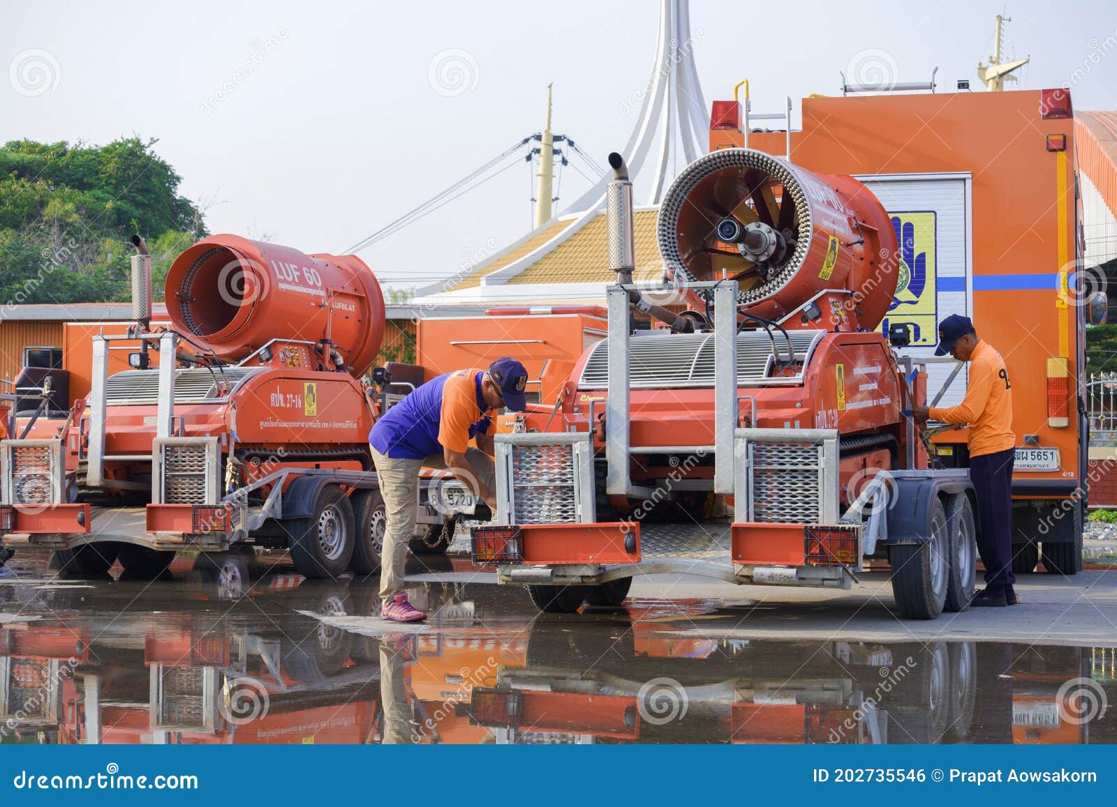 Disaster Prevention And Mitigation Workers Moving Firefighter Robots ...
