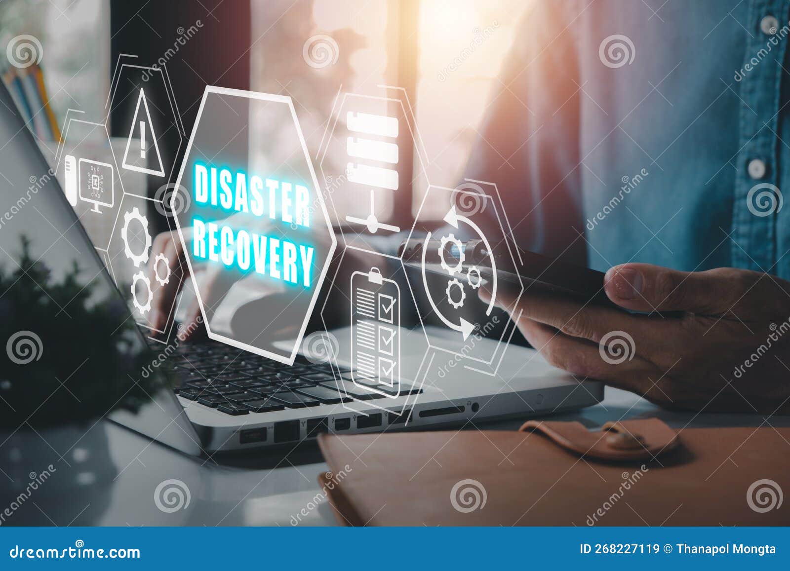 Person Hand Using Laptop Computer with Disaster Recovery Icon on ...