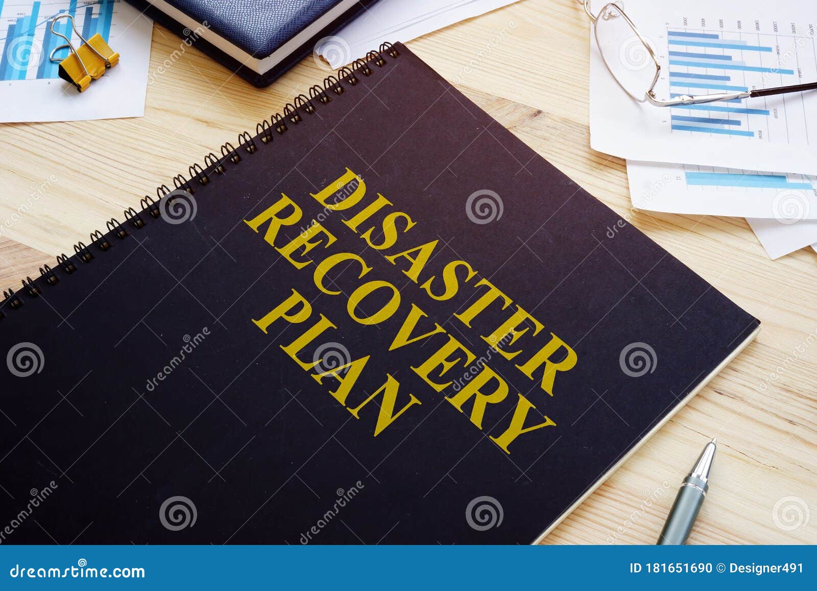Disaster Recovery Plan Book and Stack of Papers Stock Photo - Image of ...