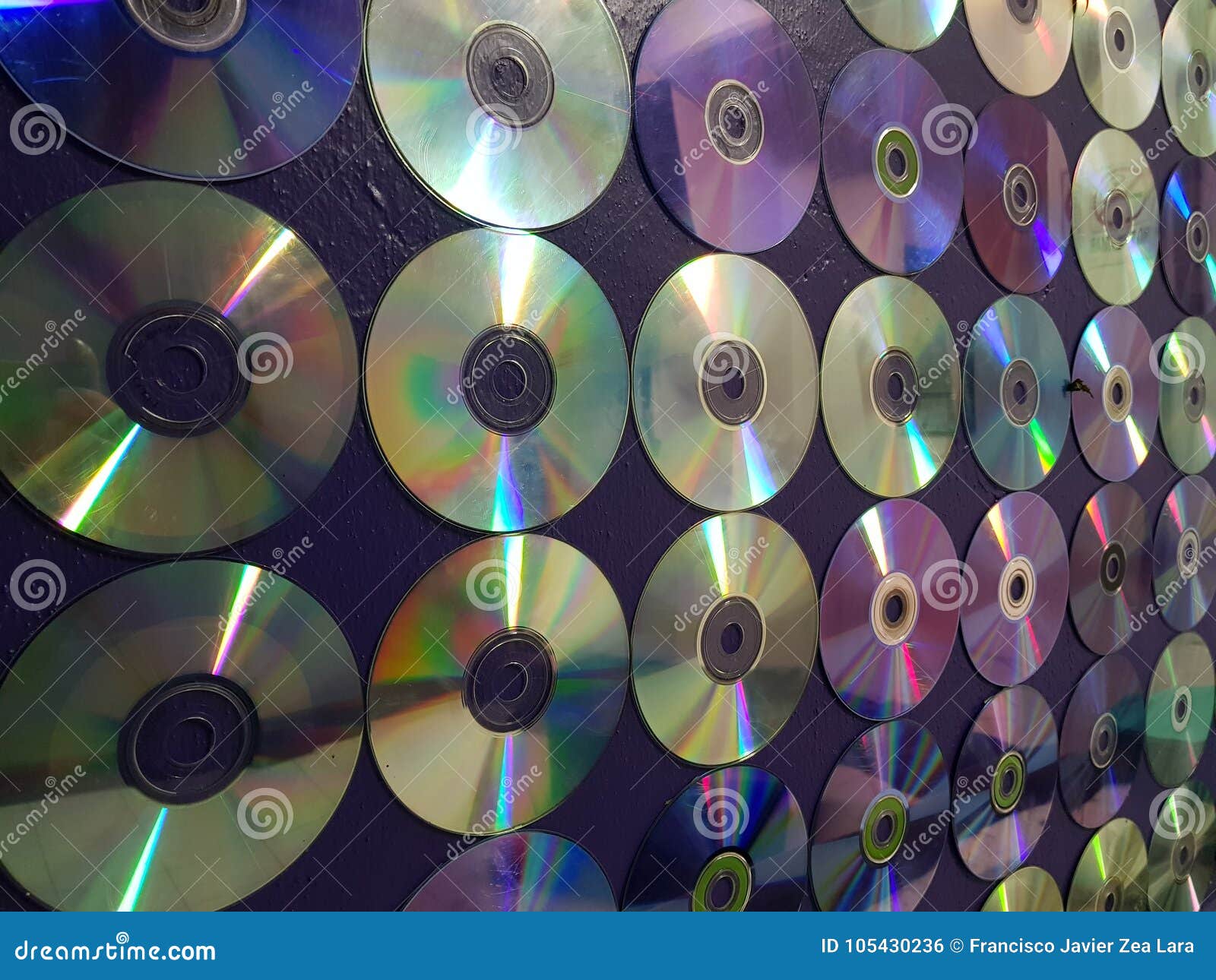 Wall Decorated with CDs and DVDs, Textured Background Stock Photo ...