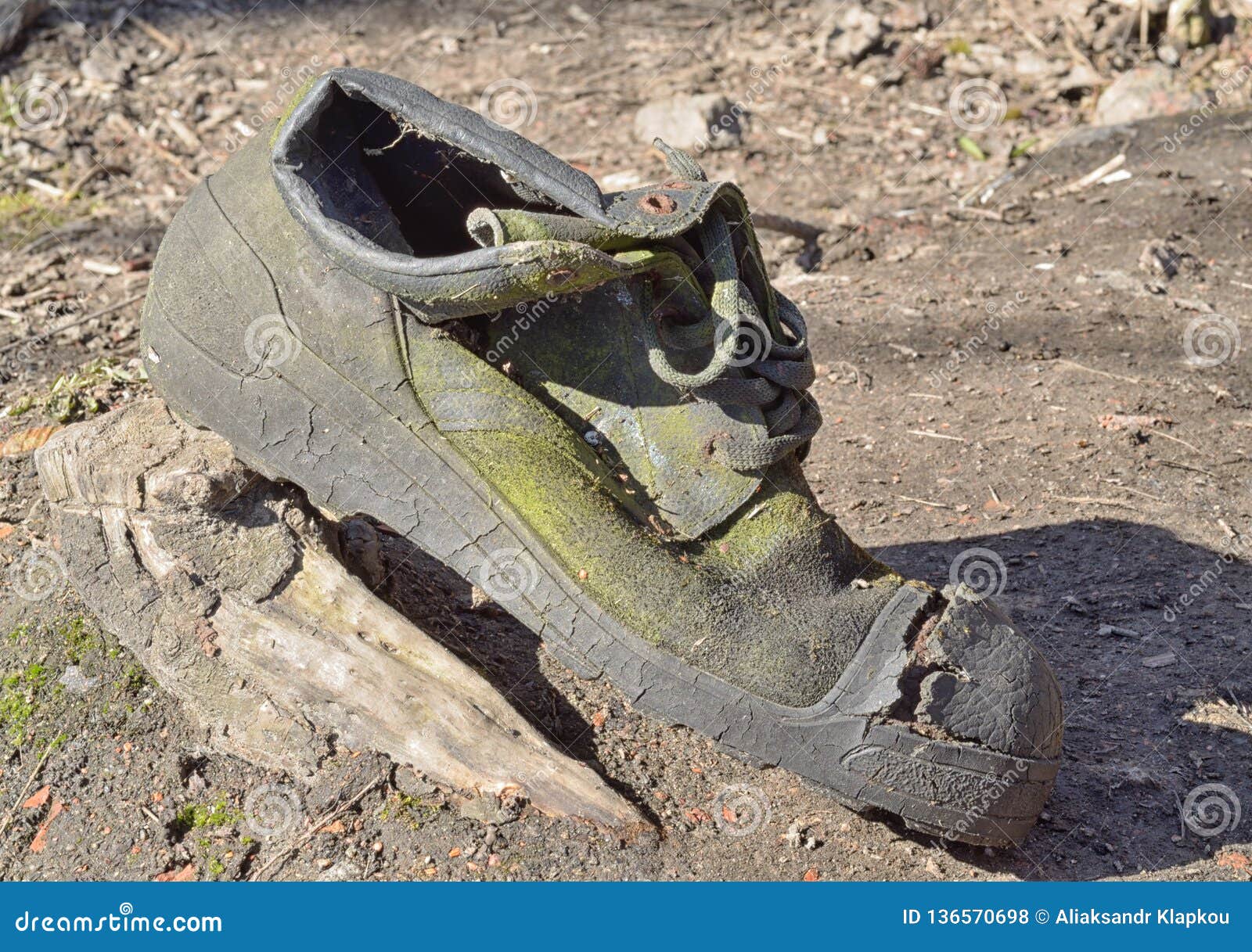 Discarded old torn shoes stock photo. Image of date - 136570698
