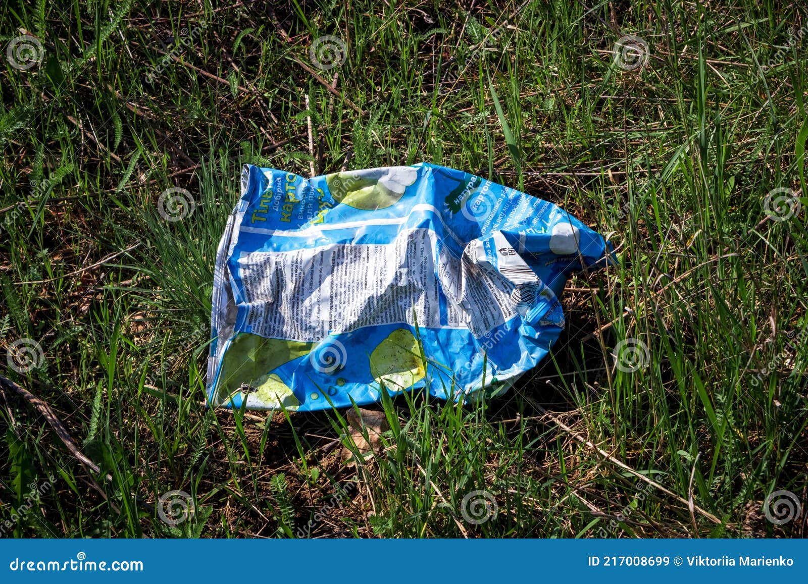 Discarded Packaging from Chips on the Grass Editorial Stock Image ...