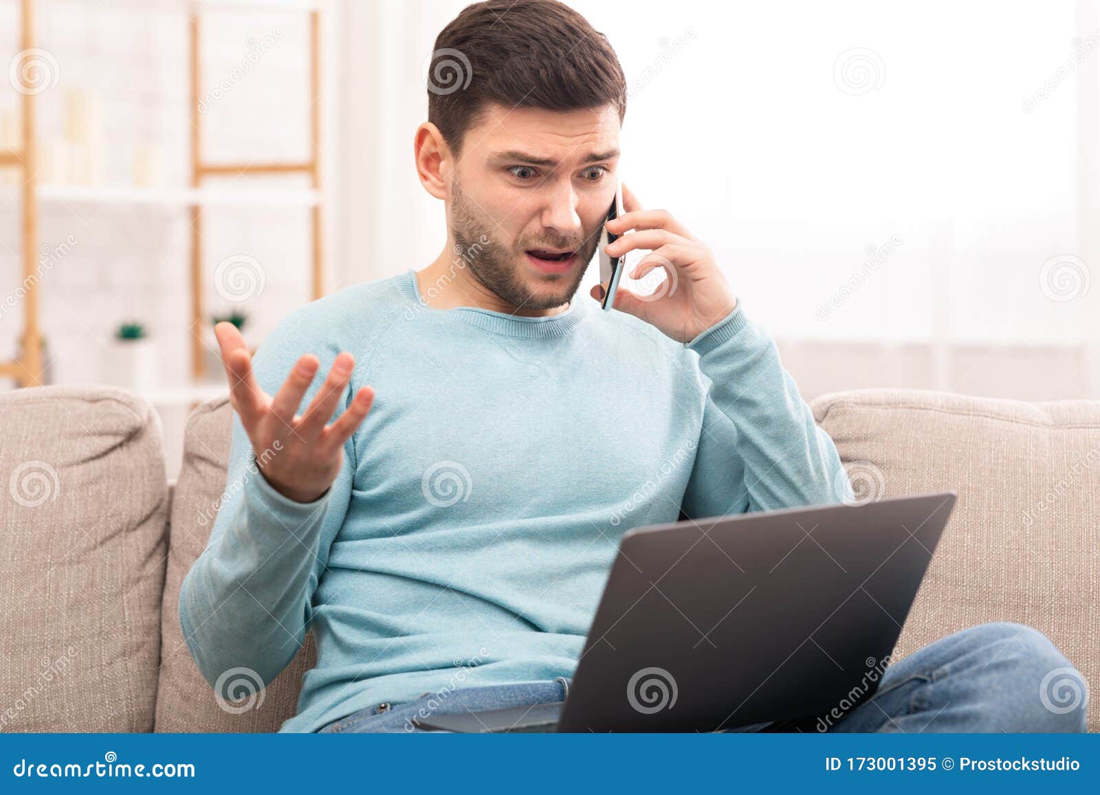 Discontented Man Calling To Customer Support Sitting with Laptop Indoor ...