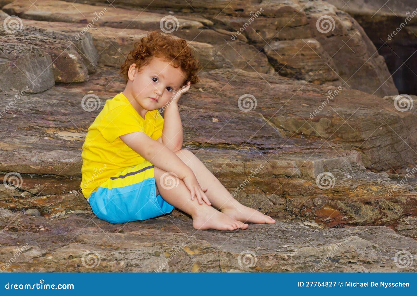 Discouraged Boy Sitting on Rocks Stock Image - Image of emotion, yellow ...
