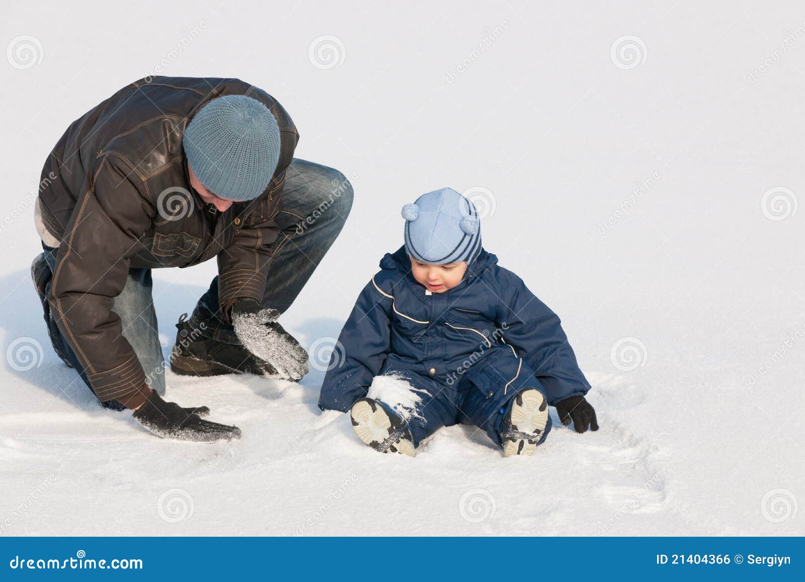 Discovering snow with dad stock photo. Image of cold - 21404366