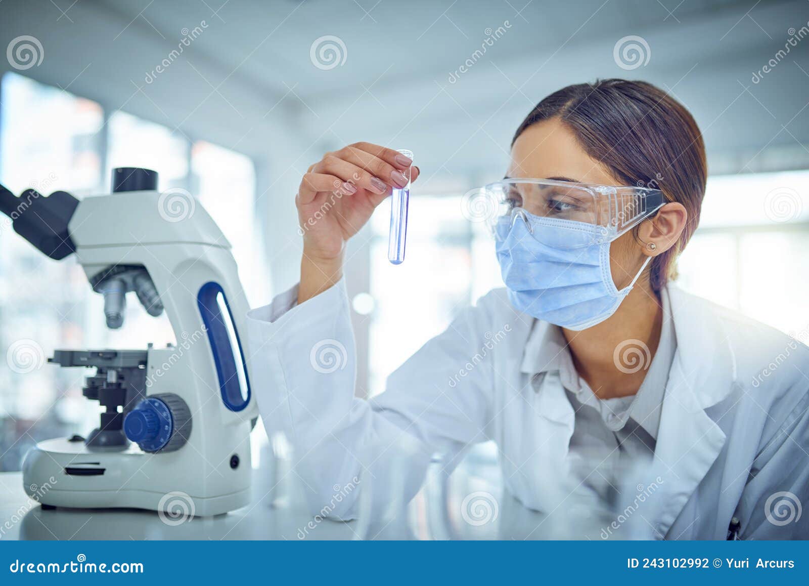 Discovering Solutions through Science. Shot of a Young Scientist ...