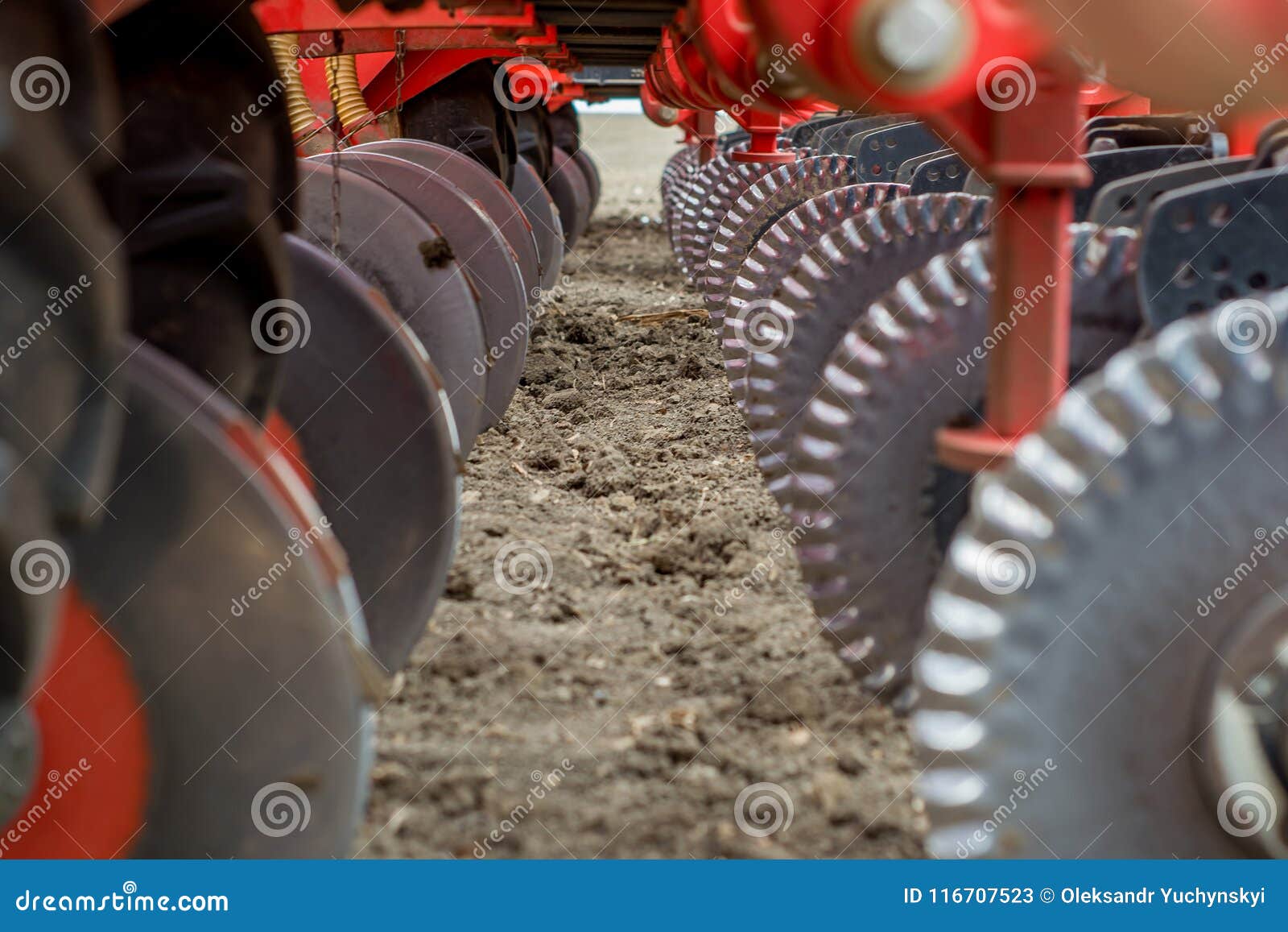 Discs Cutting the Cracks in the Ground and Spreading the Seed of a ...