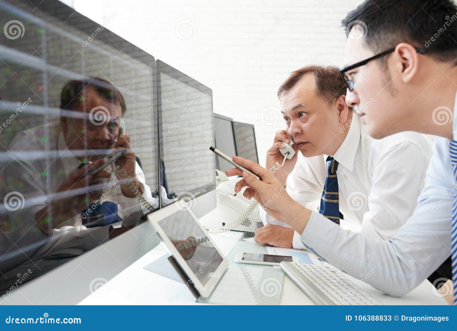 Discussing Charts on Computer Screens Stock Image - Image of statistics ...