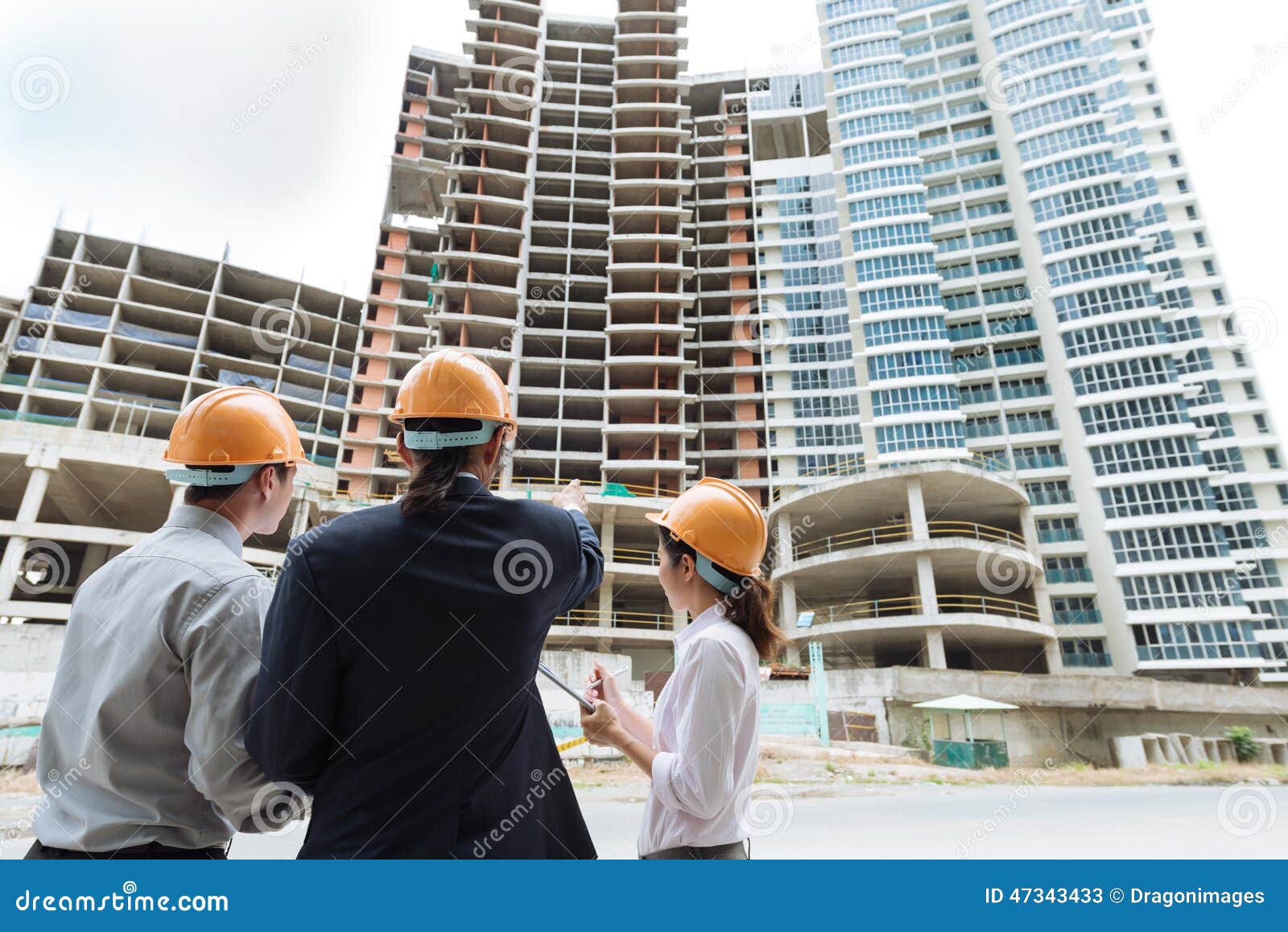 Discussing construction stock image. Image of coworkers - 47343433