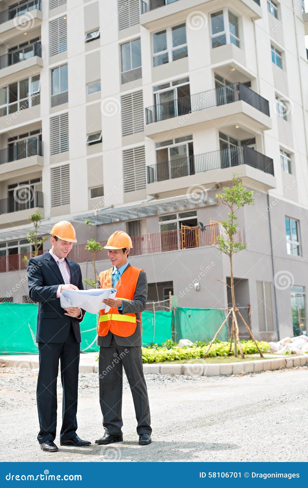 Discussing Construction Plan Stock Image - Image of caucasian, business ...