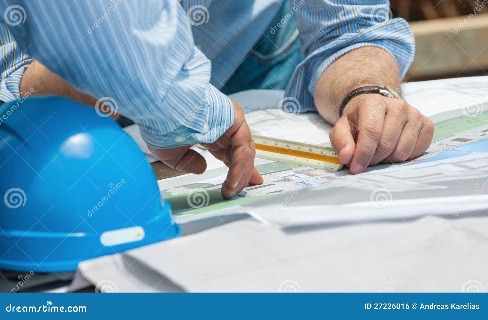 Discussing Construction Plans Stock Photo - Image of hardhat, paper: 27226016