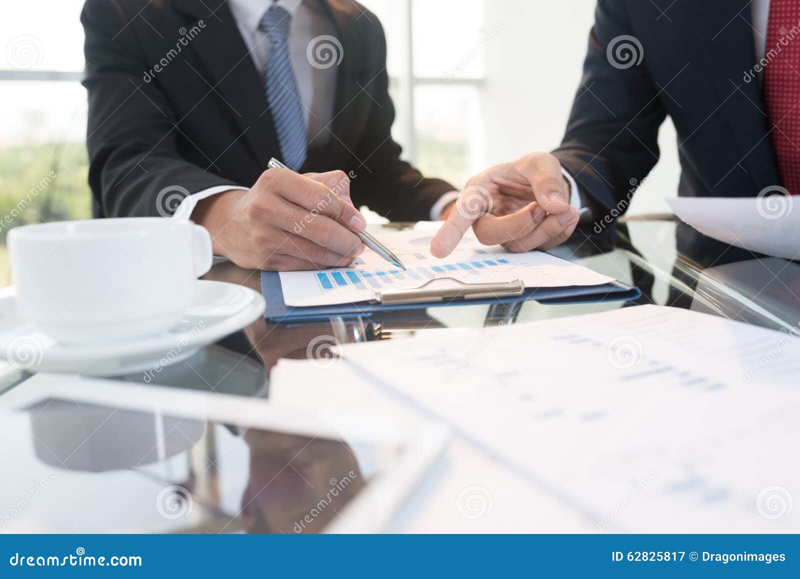 Discussing documents stock image. Image of closeup, document - 62825817