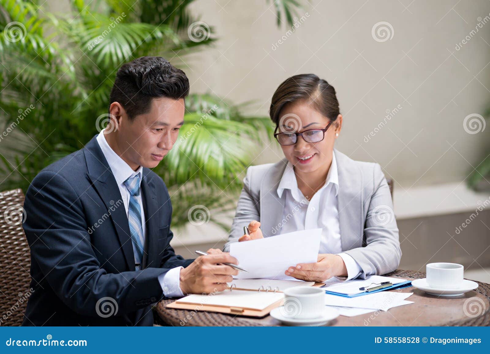 Discussing documents stock photo. Image of discussing - 58558528