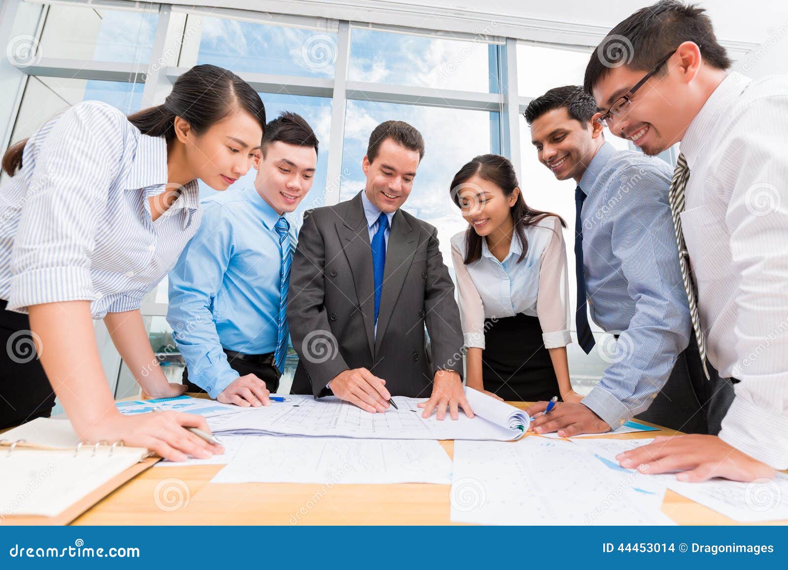 Discussing a draft stock photo. Image of graph, office - 44453014