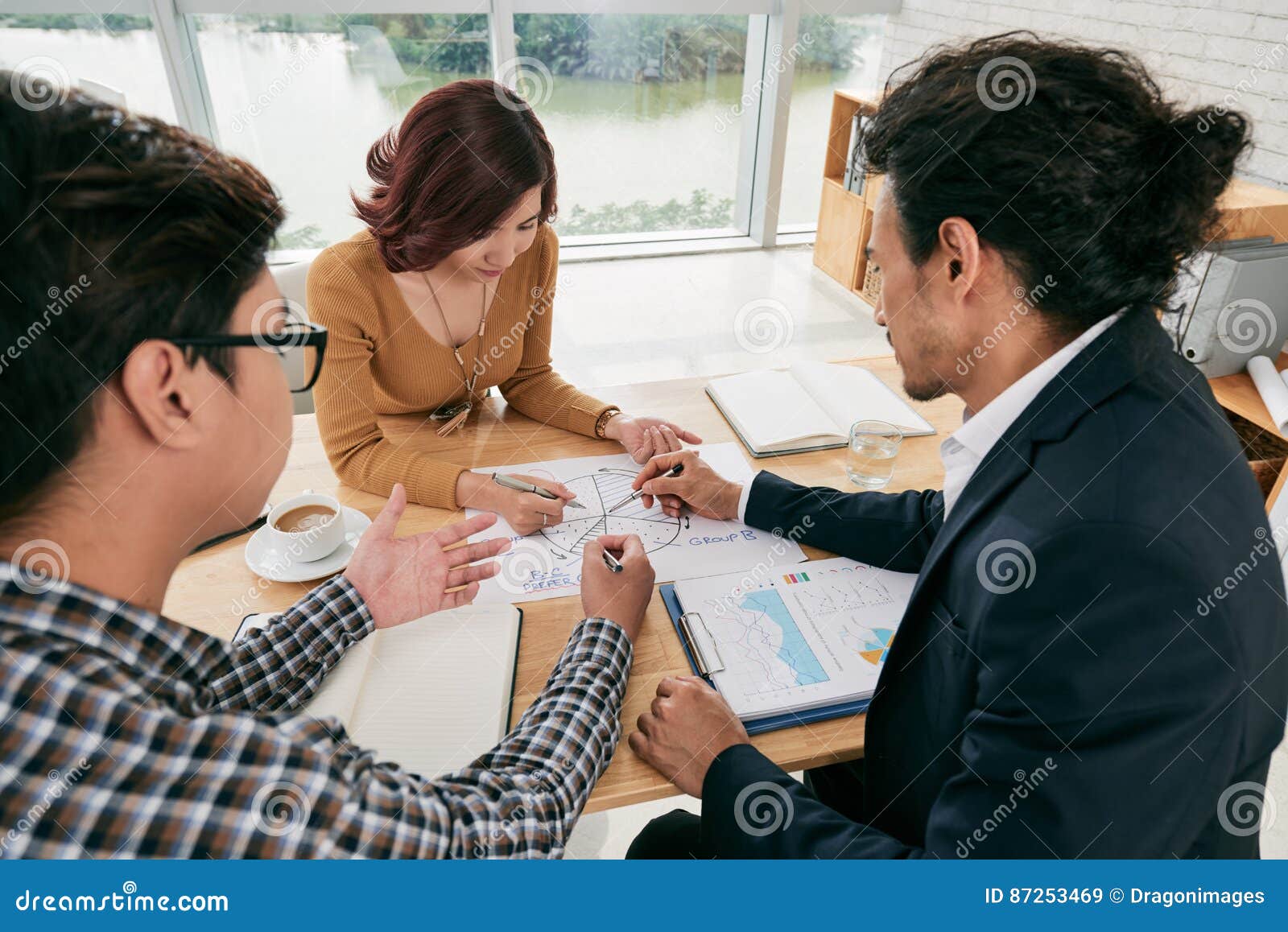 Discussing financial chart stock image. Image of report - 87253469