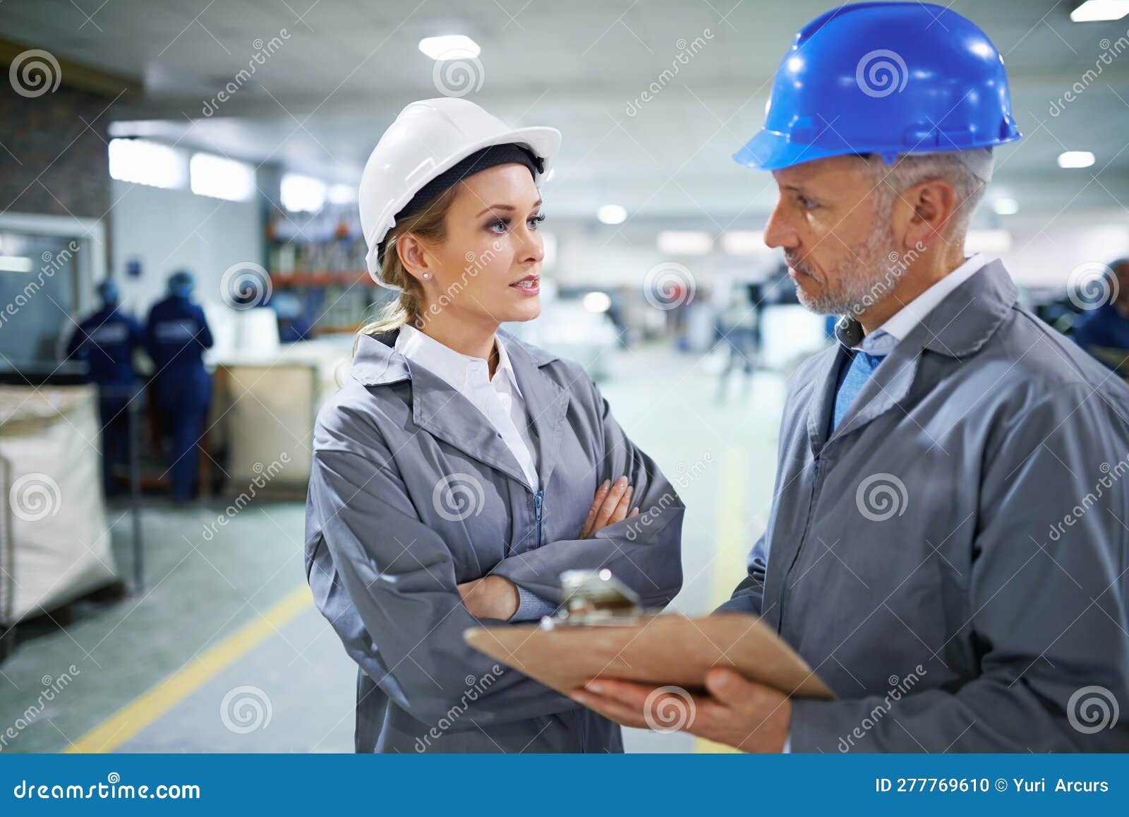 Discussing Logistics. a People Working Inside a Printing, Packaging and ...