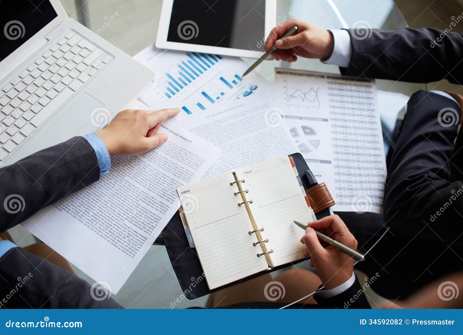Discussing papers stock photo. Image of chart, idea, paperwork - 34592082